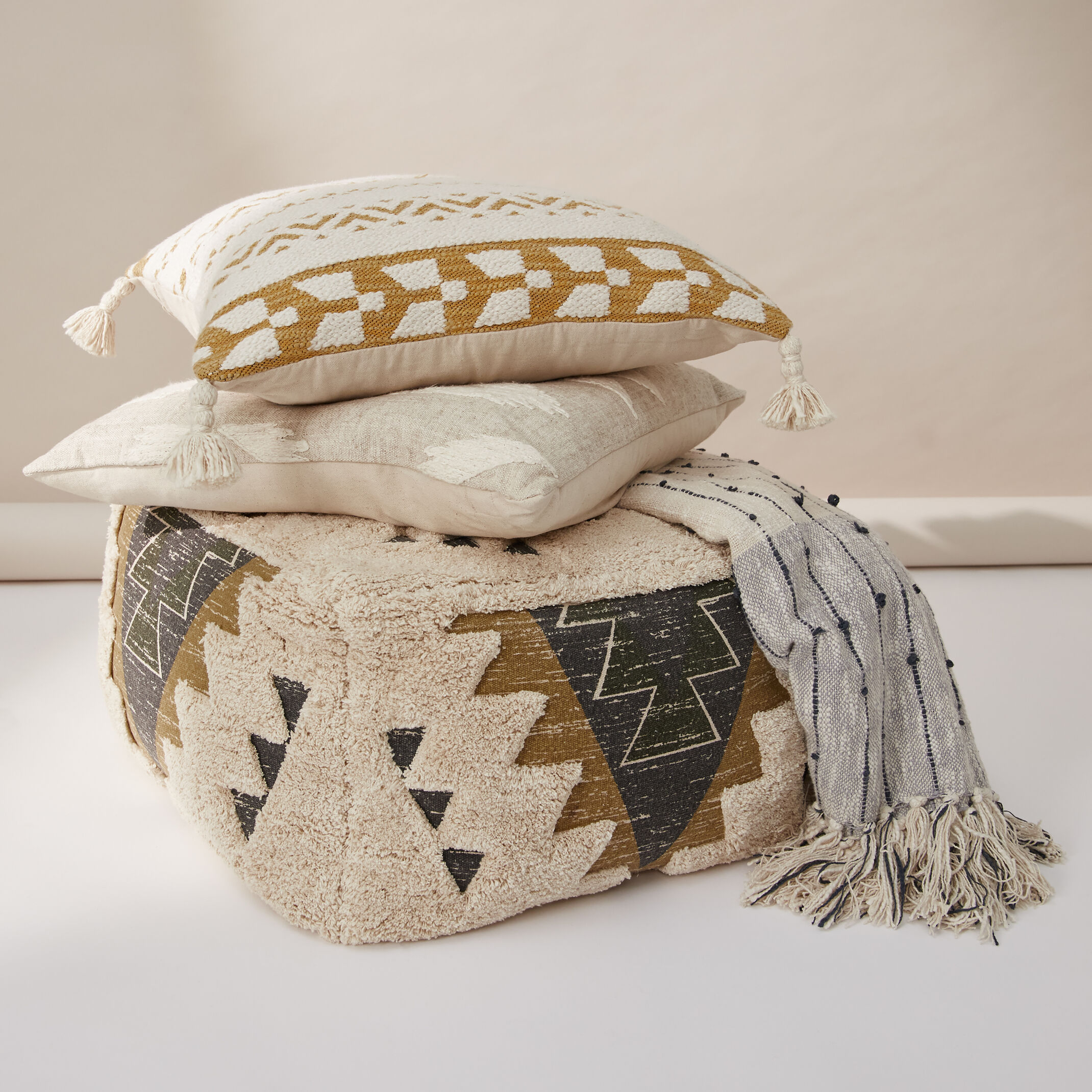 Tribal Geometric Patterned Footstool in Black & Gold | Inside Story